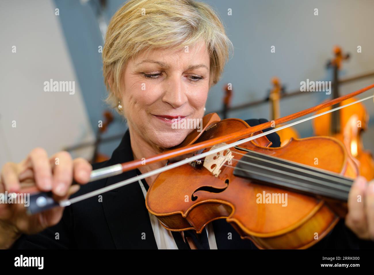 Senior lady playing violin Stock Photo - Alamy