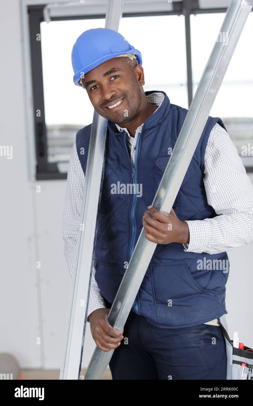 Worker carrying rebar hi-res stock photography and images - Alamy