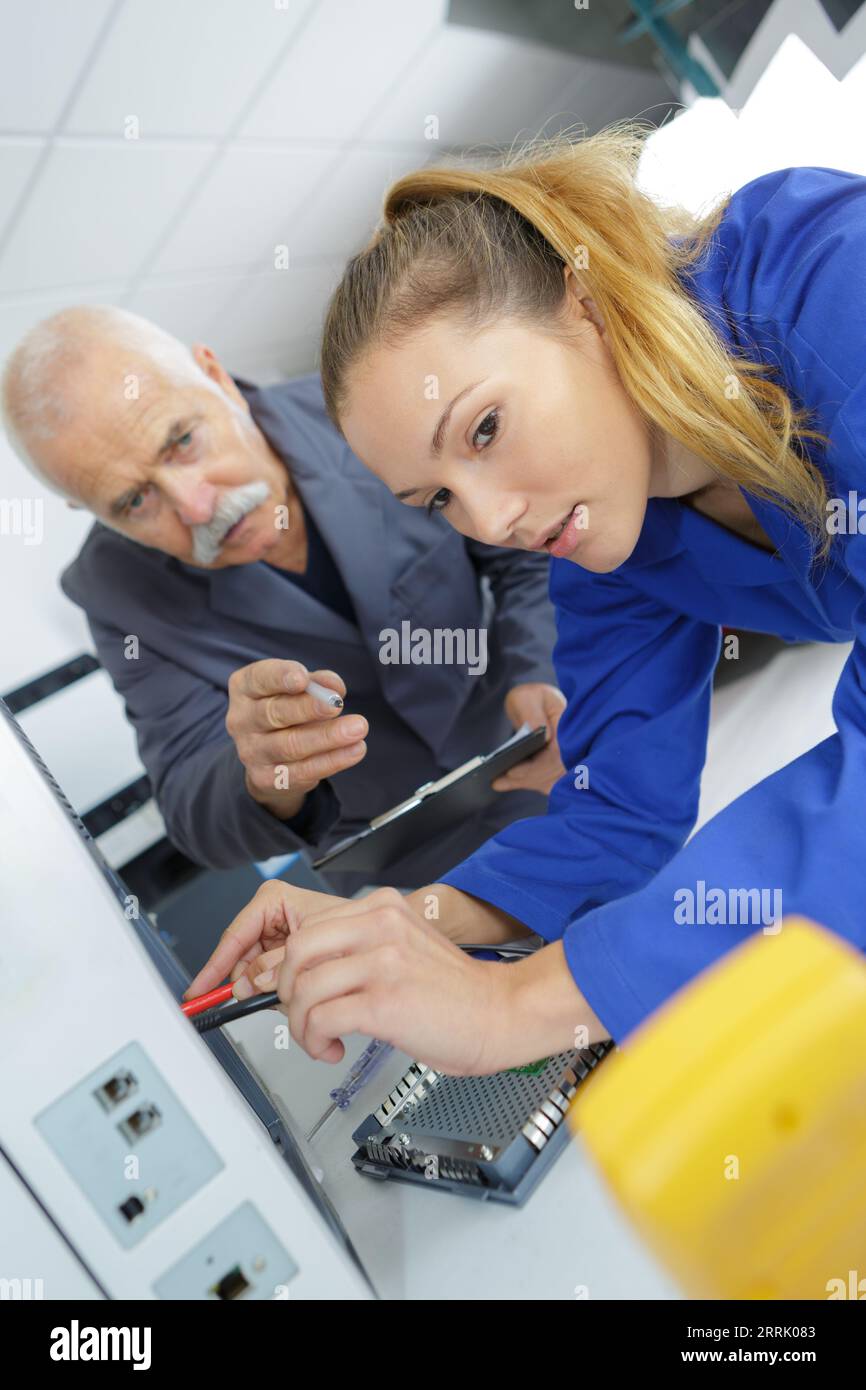 technician using multimeter to test appliance Stock Photo - Alamy