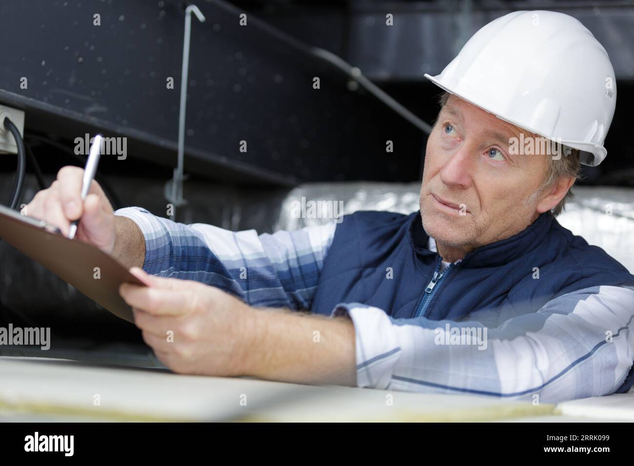 man repairing electrical wiring on the ceiling Stock Photo - Alamy