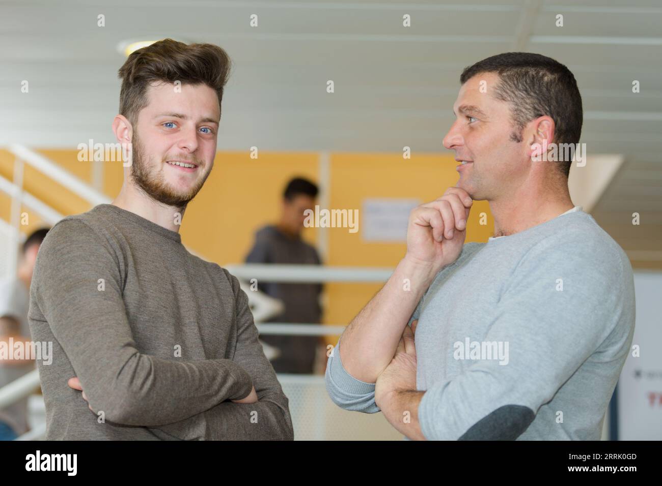 Teacher student talking hallway hi-res stock photography and images - Alamy