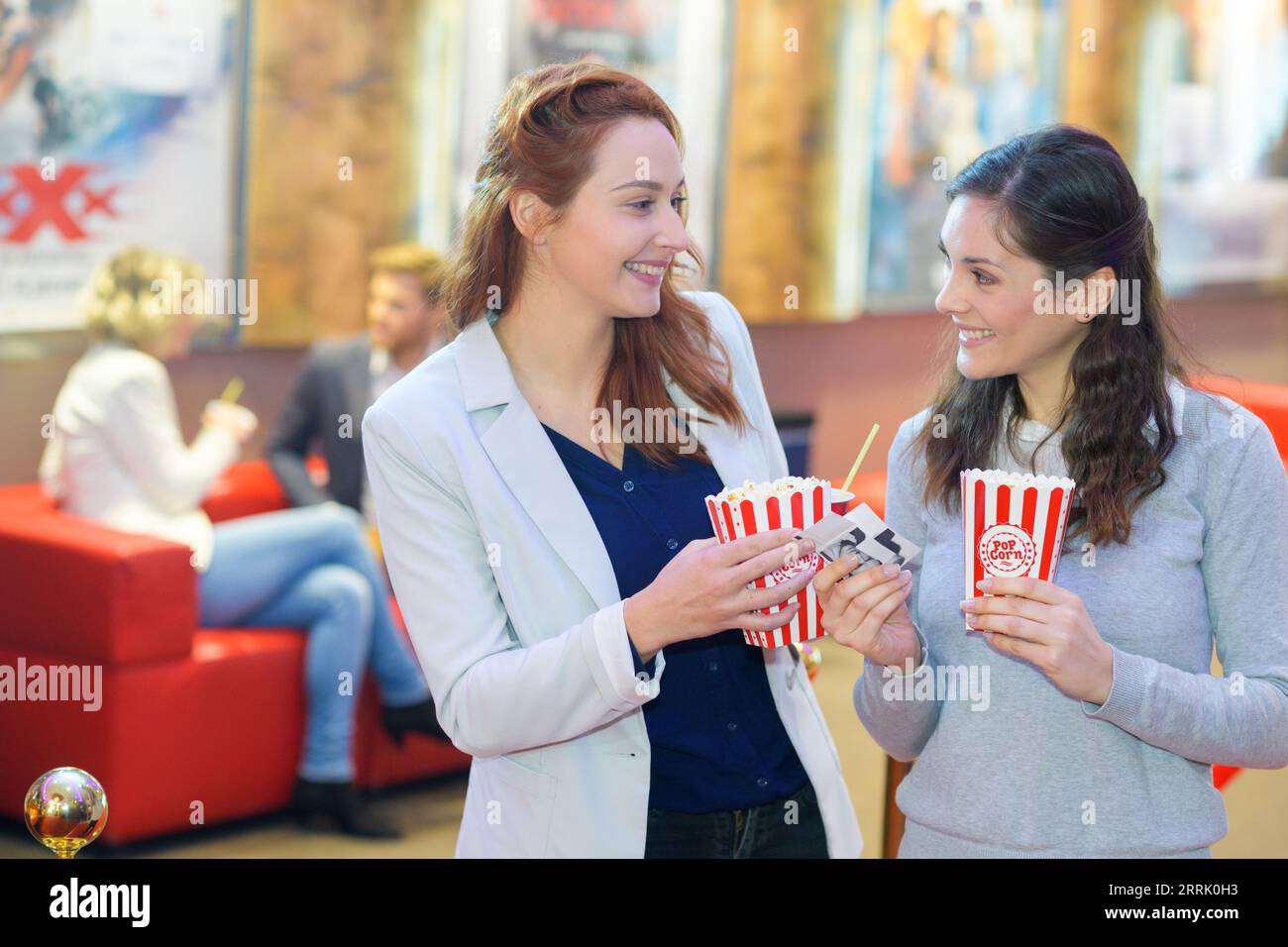 two young women in the cinema Stock Photo - Alamy
