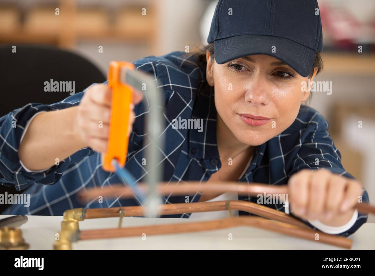Female plumber pipe cut hi-res stock photography and images - Alamy