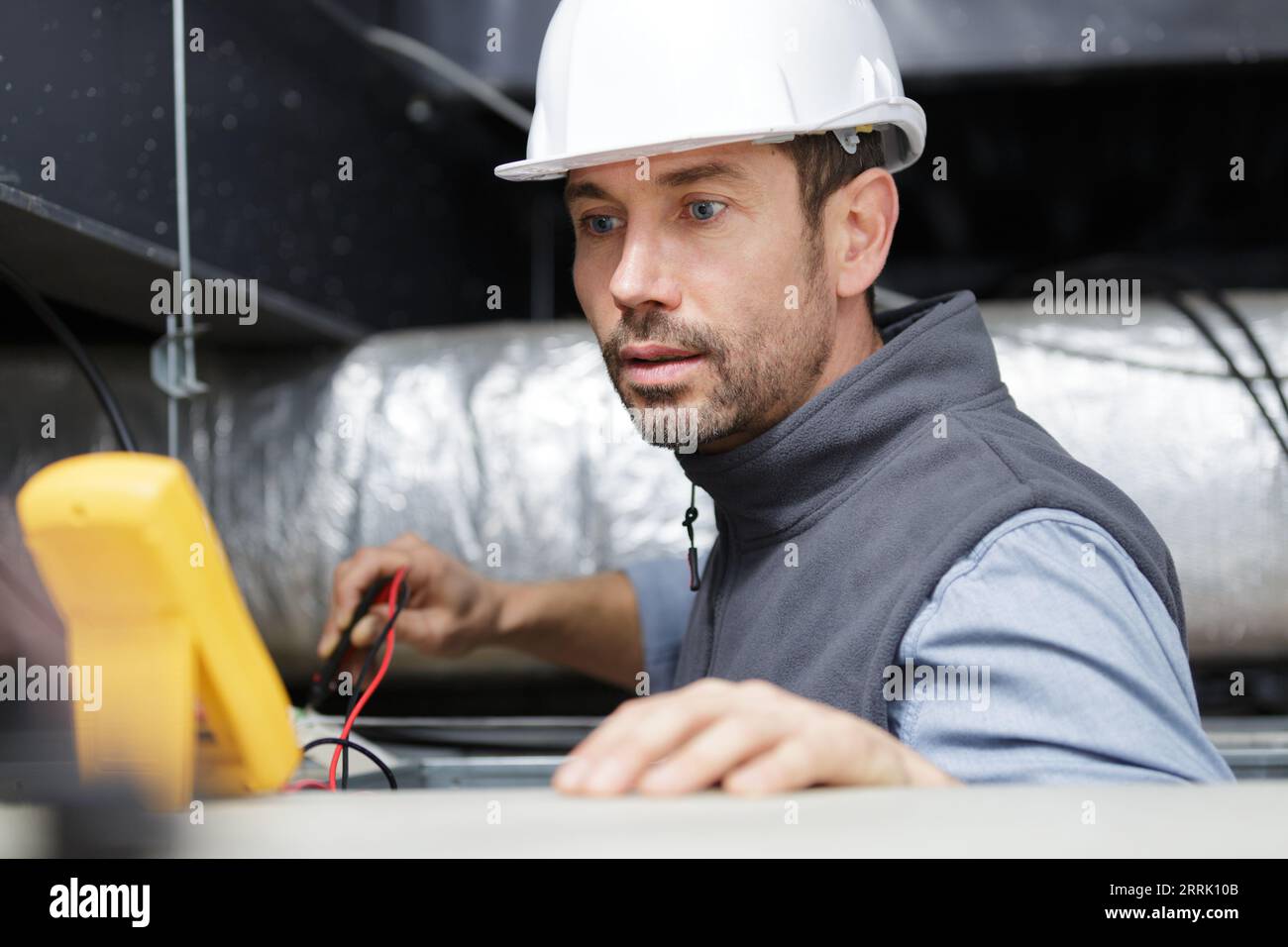 working with high voltage cable Stock Photo - Alamy