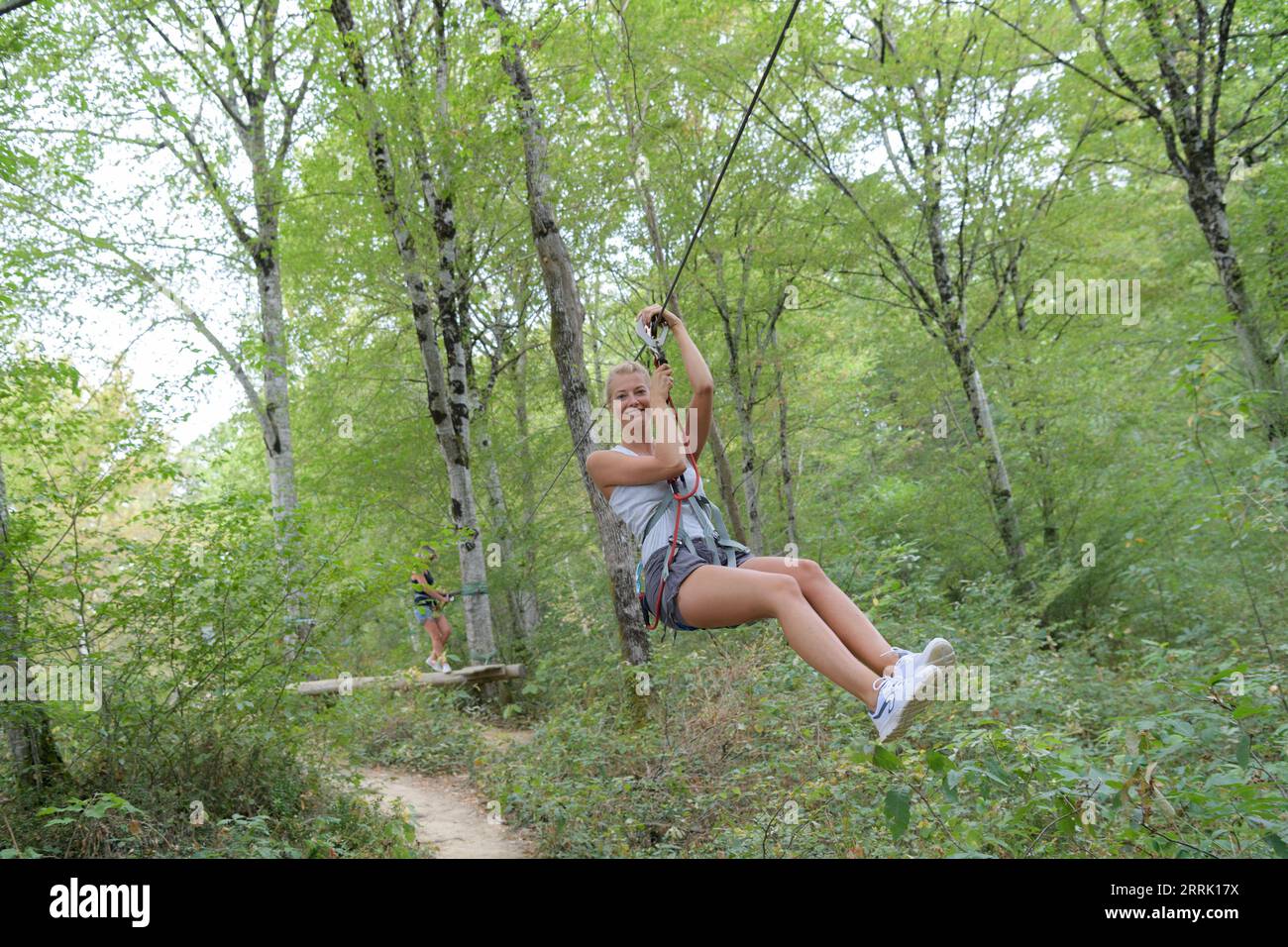 Woman sliding down hi-res stock photography and images - Alamy