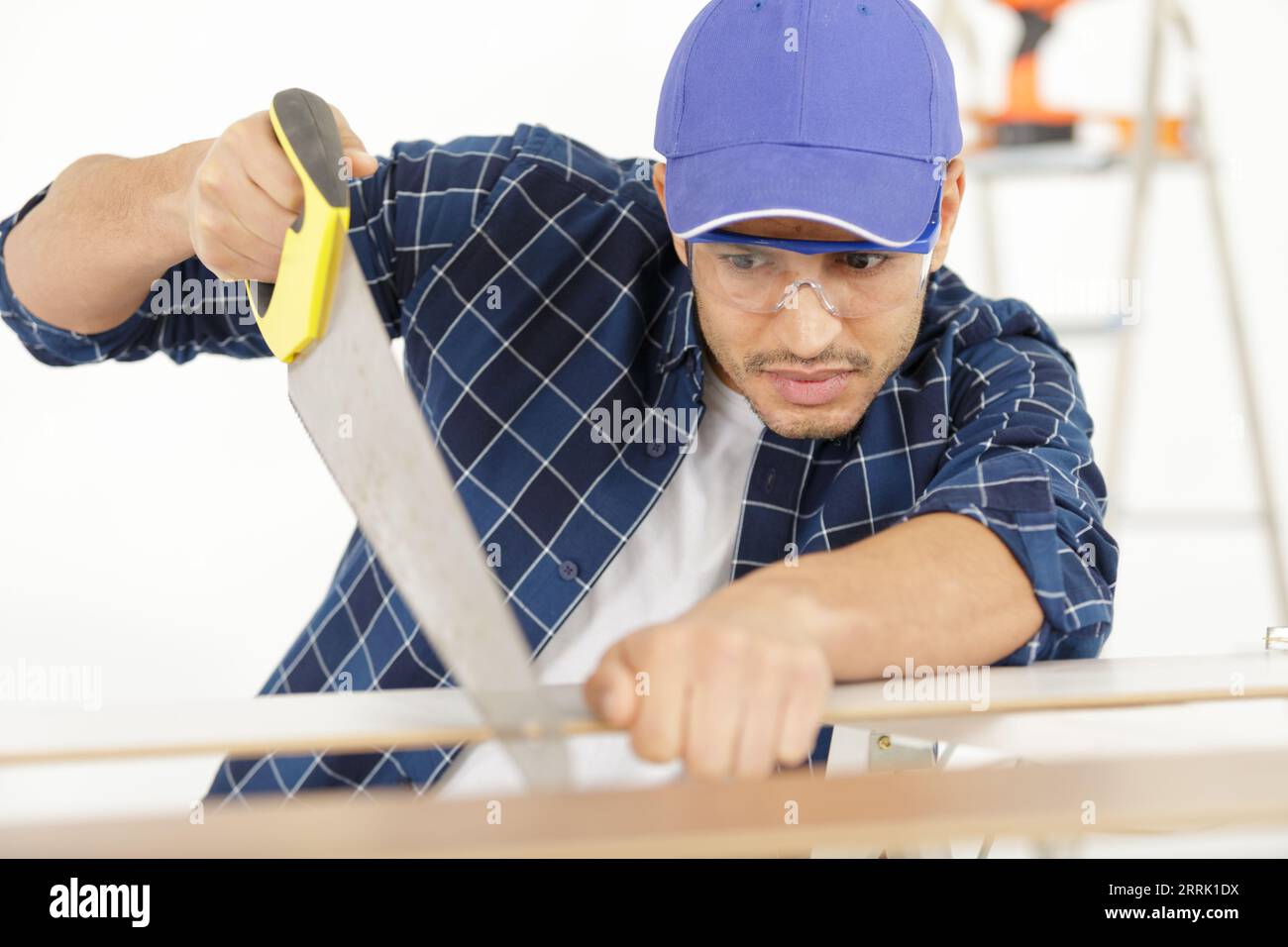 Man using handsaw hi-res stock photography and images - Alamy