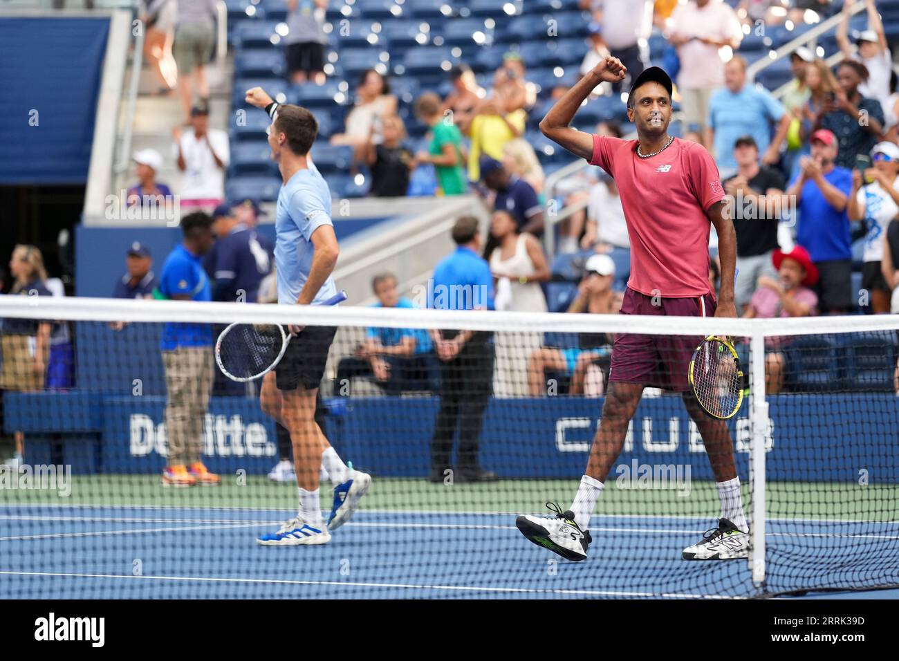 Rajeev Ram and Joe Salisbury wave to the crowd after winning a men's ...