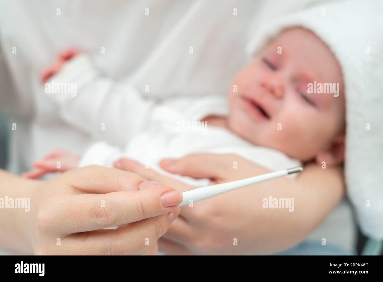 Mother soothing crying baby newborn hi-res stock photography and images ...