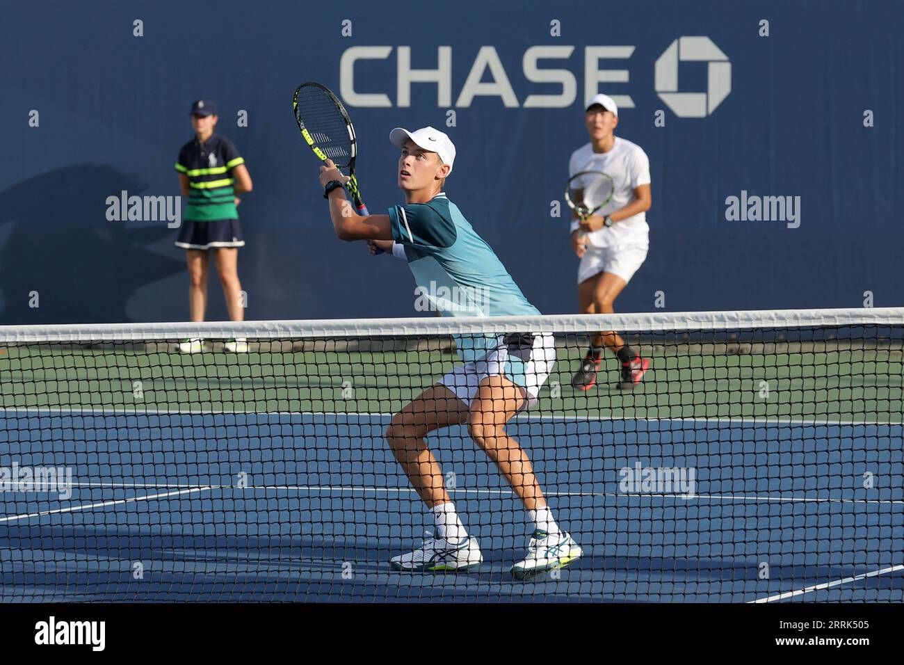 Cooper Williams in action during a junior boys' doubles quarterfinal ...
