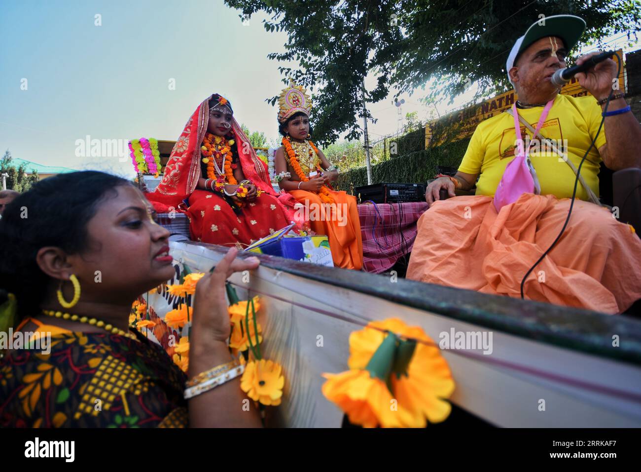 A young Hindu boy and girl, dressed as Lord Krishna and Radha, take part in the Hindu religious ...