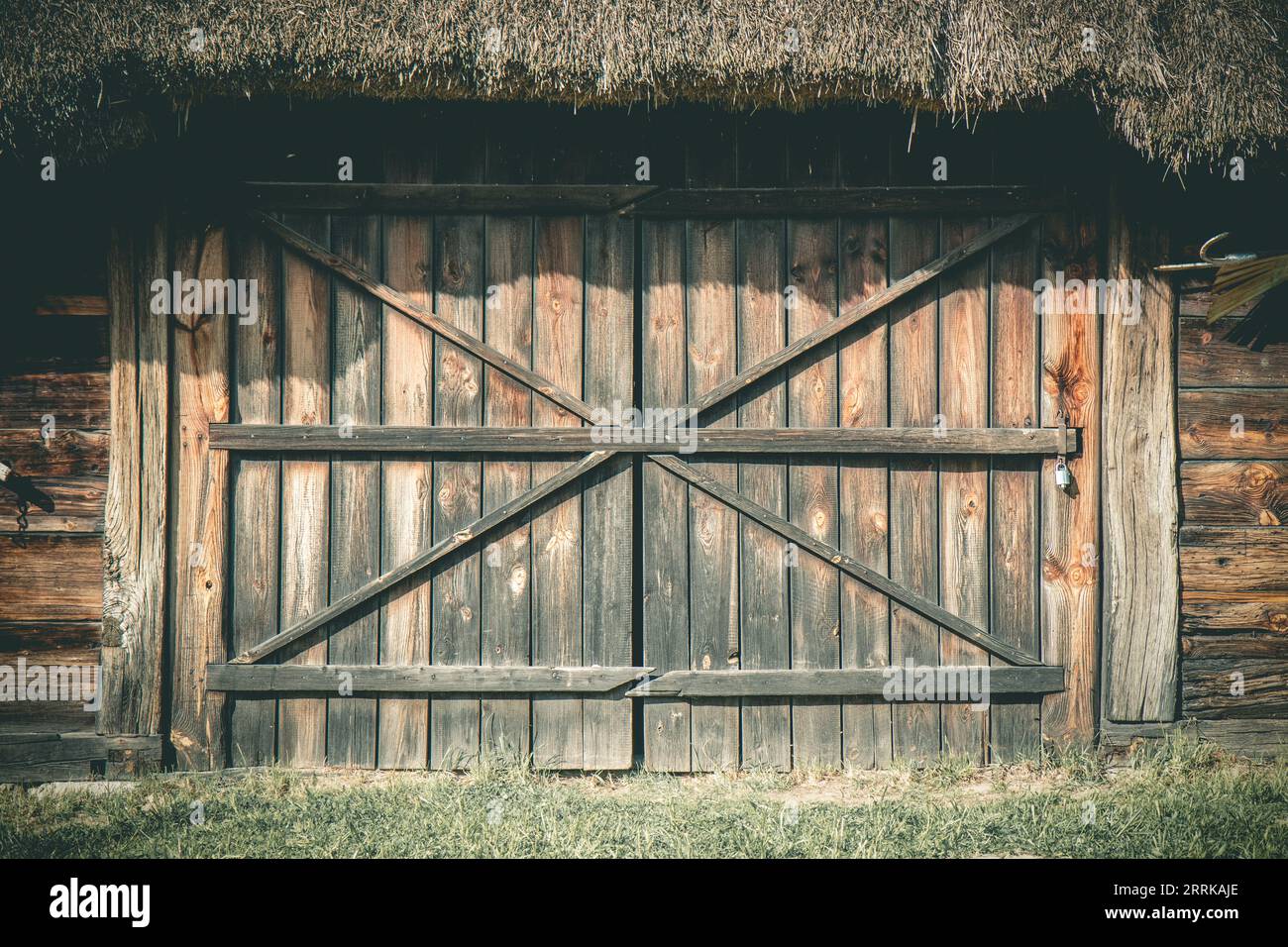 Door of old wooden rural barn with thatched roof Stock Photo - Alamy