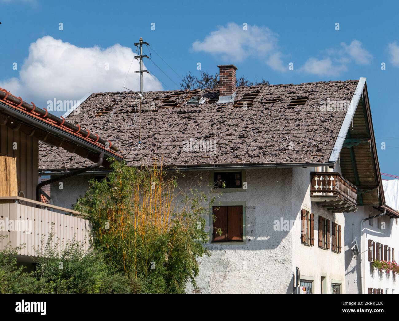 Destroyed roof, hail damage to a house after a severe thunderstorm ...