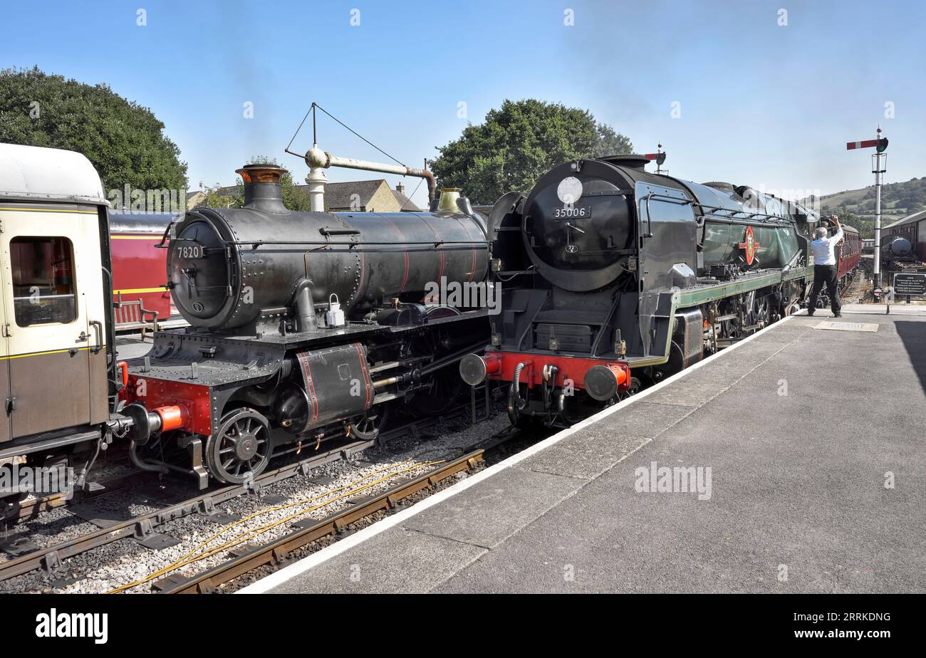 Two steam trains at the GWR preserved train station platform Winchcombe Gloucestershire England ...