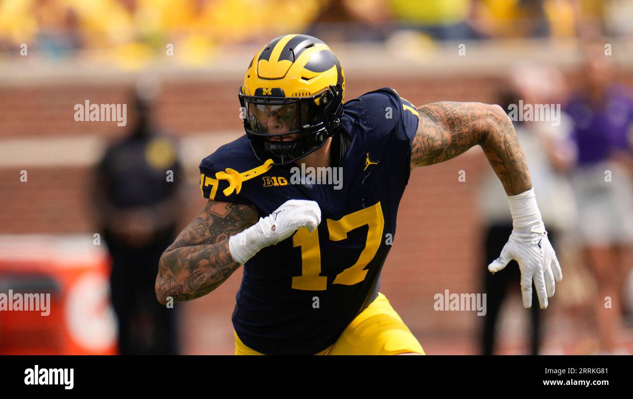 Michigan defensive end Braiden McGregor (17) plays against East ...