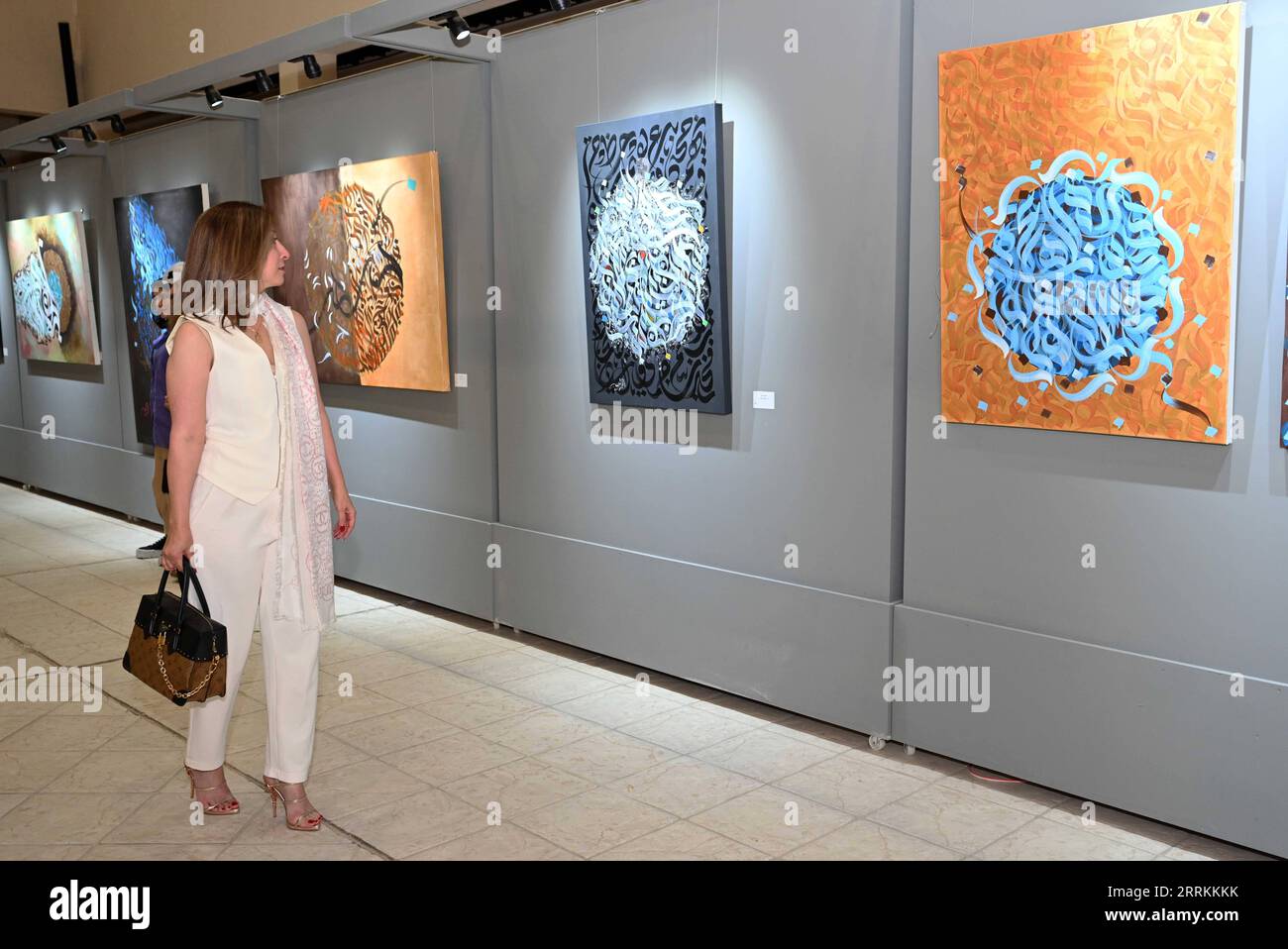 220913 -- KUWAIT CITY, Sept. 13, 2022 -- A woman visits an exhibition ...
