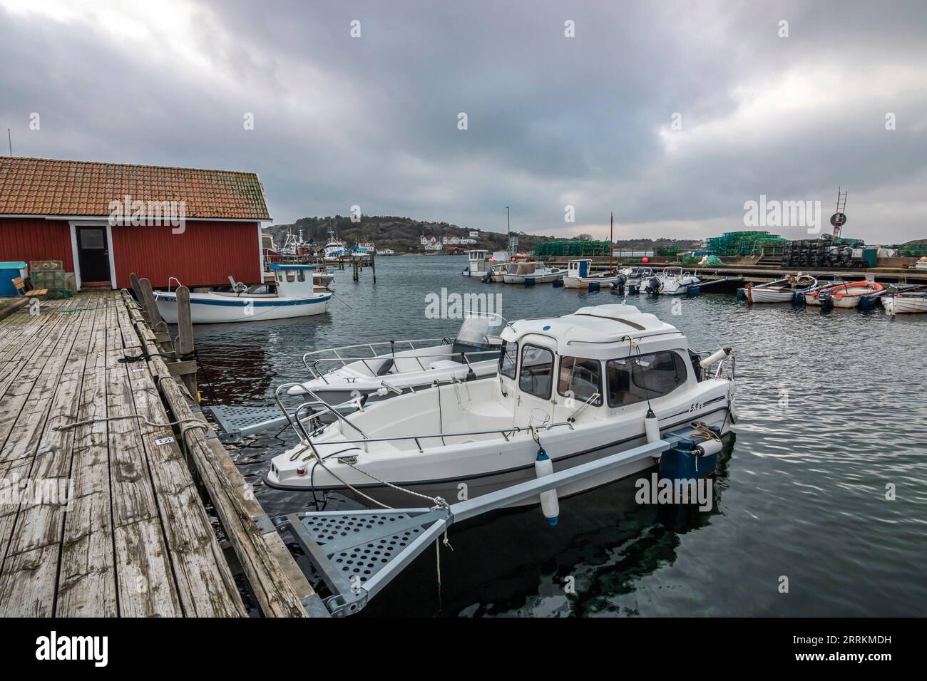 A harbor in a fjord in Sweden, rainy weather in the fishing port on the ...