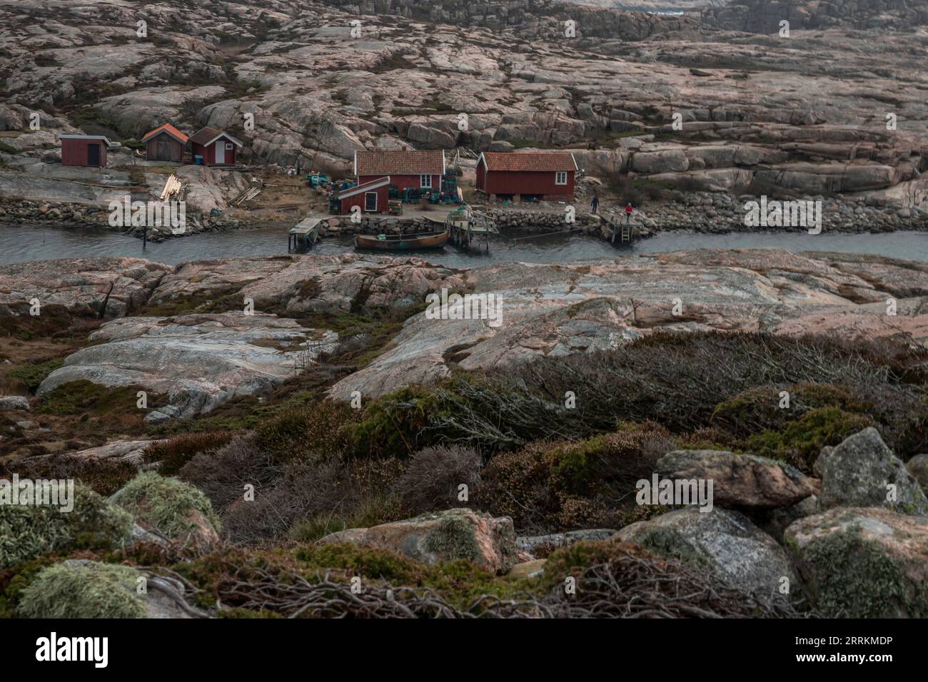 A harbor in a fjord in Sweden, rainy weather in the fishing port on the ...