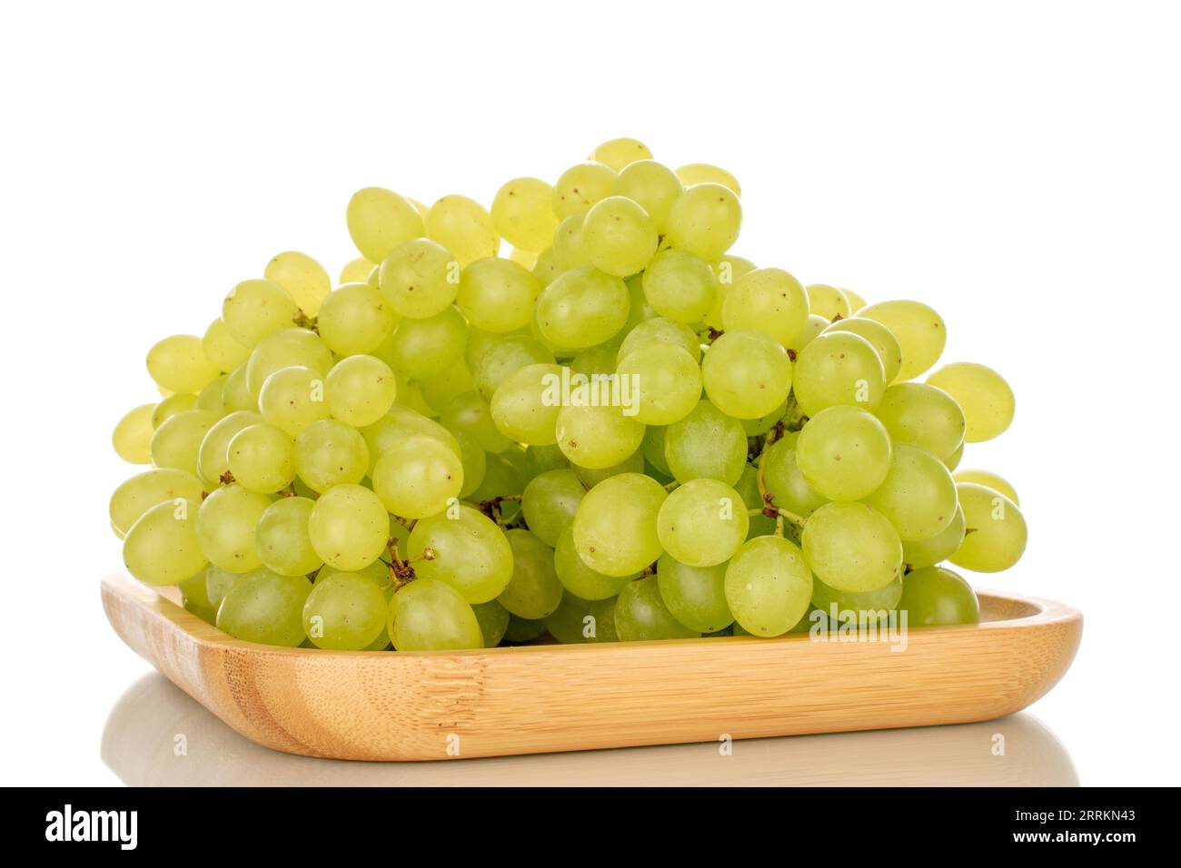 Sweet juicy seedless grapes on bamboo tray, macro, isolated on white ...