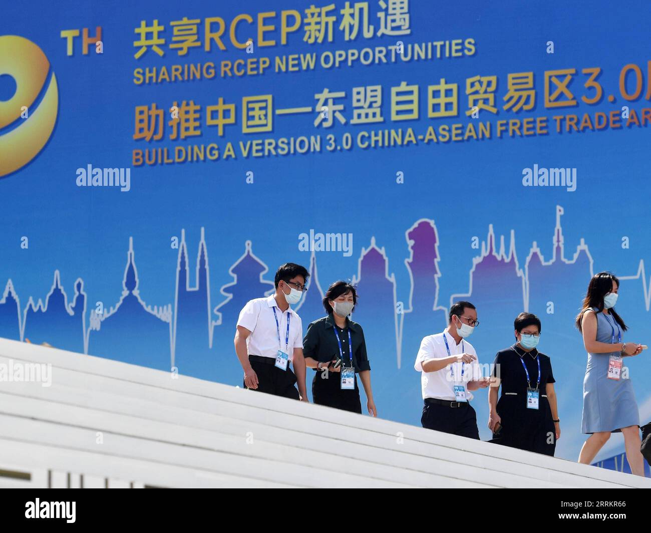 220916 -- NANNING, Sept. 16, 2022 -- People walk out of the Nanning ...