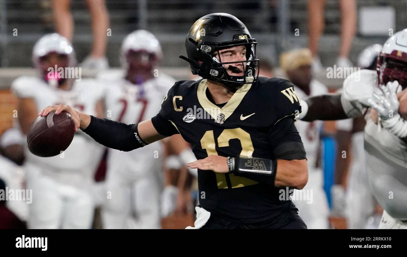 Wake Forest quarterback Mitch Griffis (12) looks to pass against Elon ...
