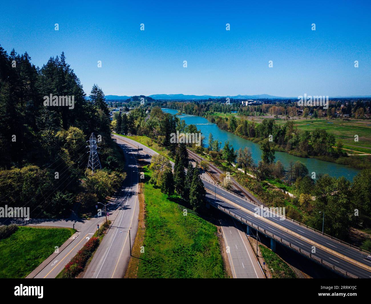 An aerial view of a freeway bridge crossing over a river in Eugene ...