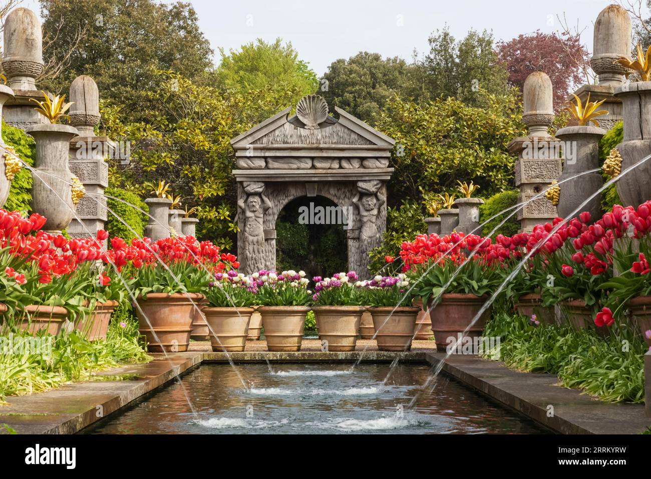 Water feature and fountains with tulips in bloom hi-res stock ...