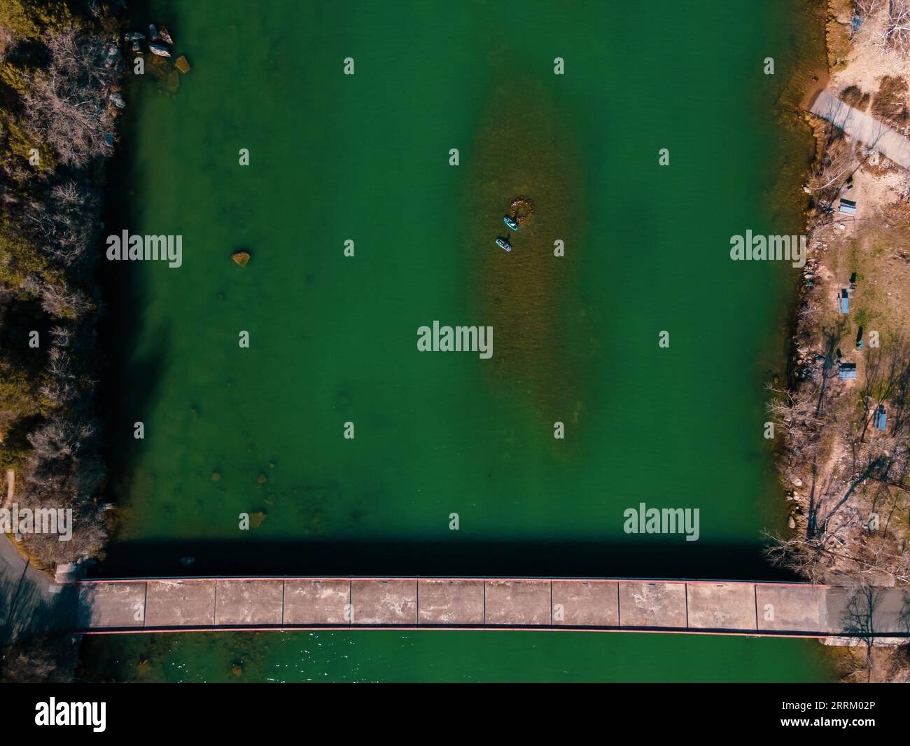an aerial view of Mansfield Dam with crystal-clear blue water on a ...
