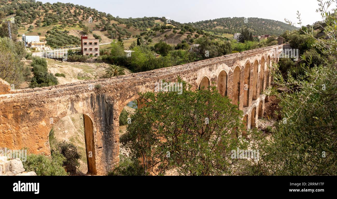 Ancient Haroune aqueduct near the archeological Roman city of Volubilis ...