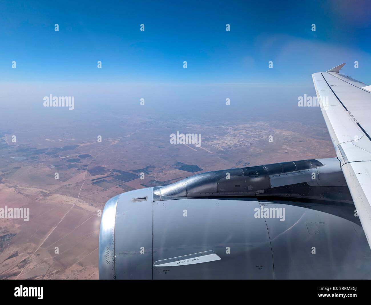 Aerial view of Moroccan countryside seen from an airplane, a turbine in ...