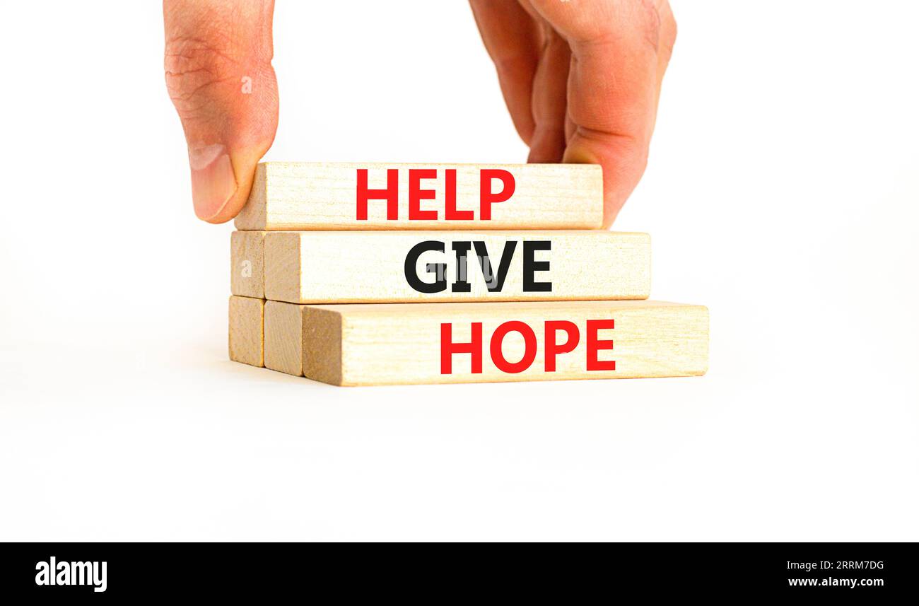 Help give hope symbol. Concept word Help give hope on beautiful wooden ...