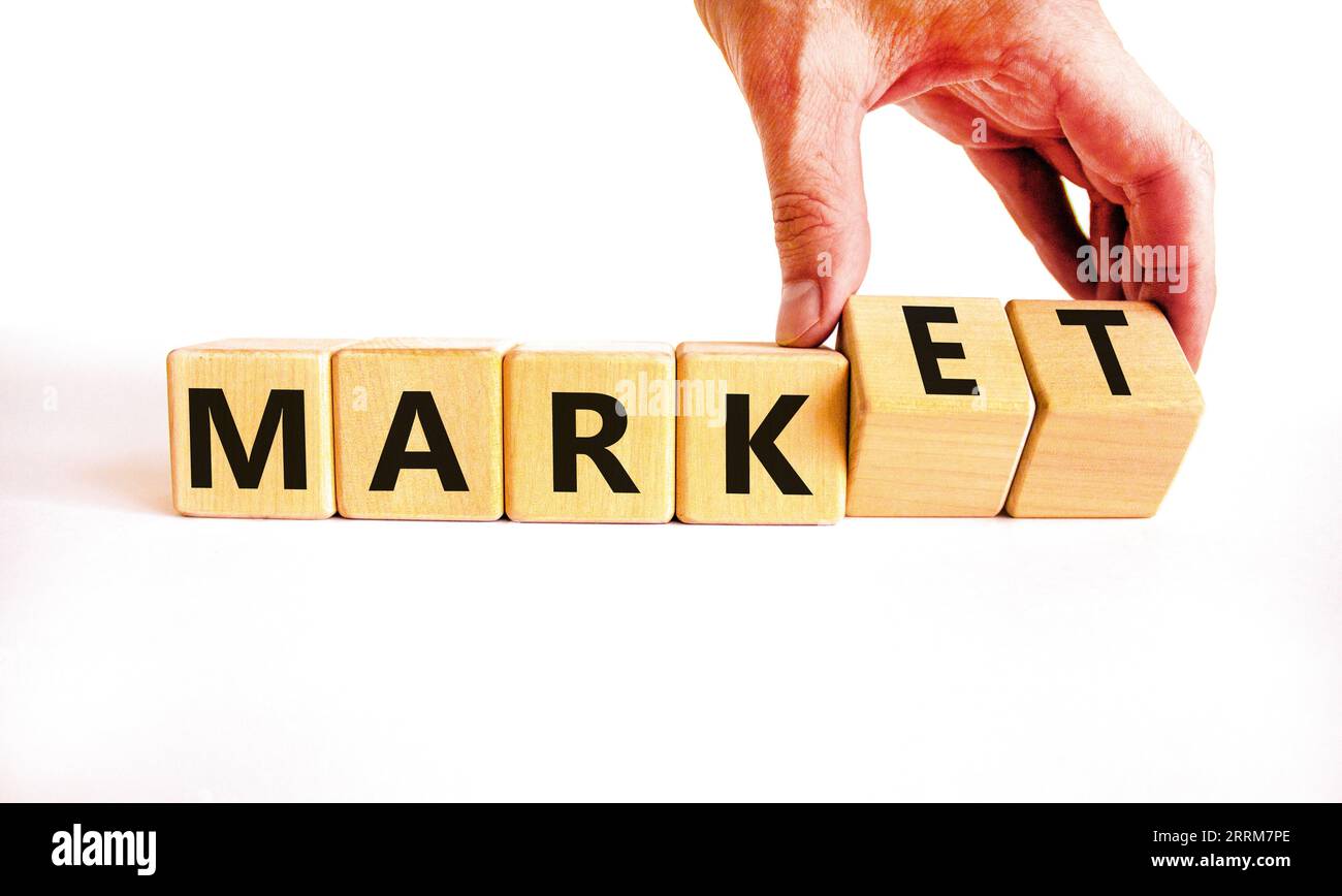 Mark of market symbol. Businessman turns wooden cubes and changes word ...