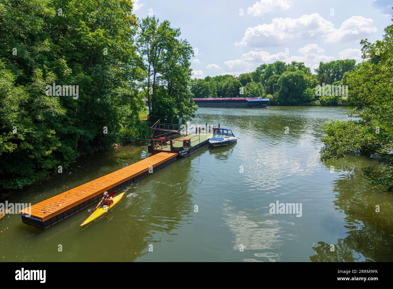 Hanau, mouth of river Kinzig into river Main, canoeist, cargo ship in ...
