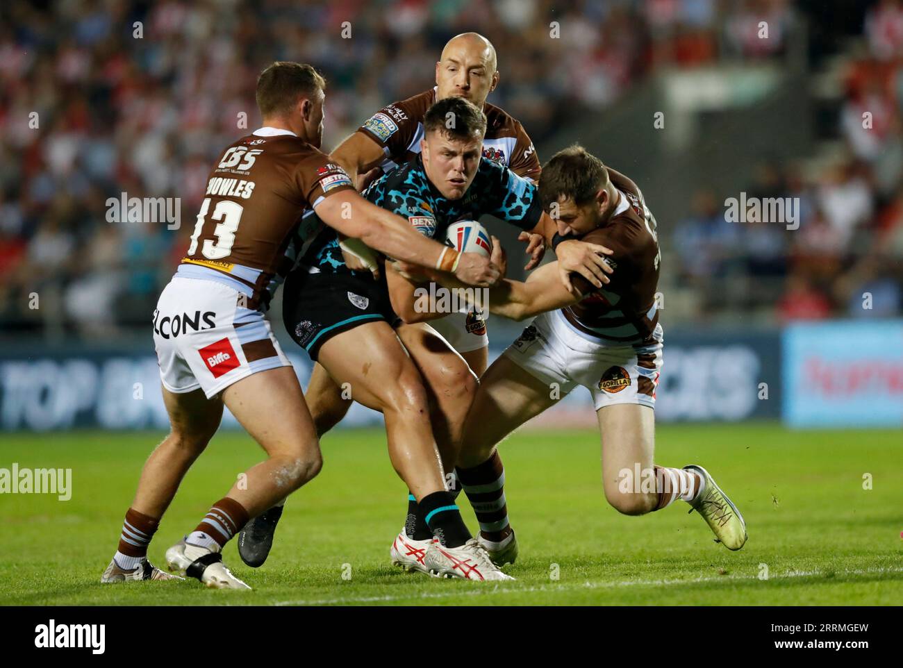 Leigh Leopards' Kai O'Donnell is tackled by St Helens' James Roby and ...