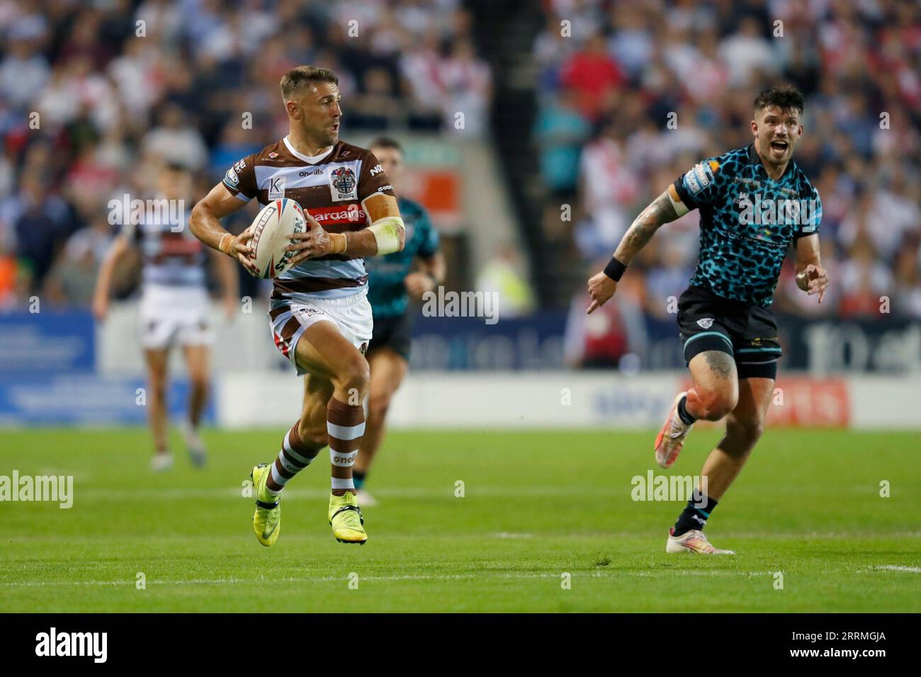 St Helens' Tommy Makinson breaks away before scoring their sides first ...