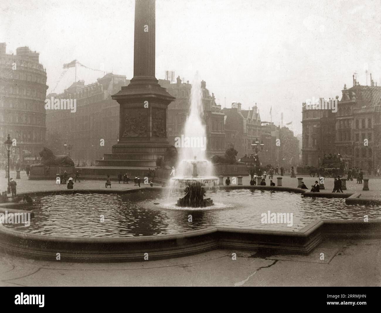 London, England. 1911 - A view of one of the fountains and the base of ...