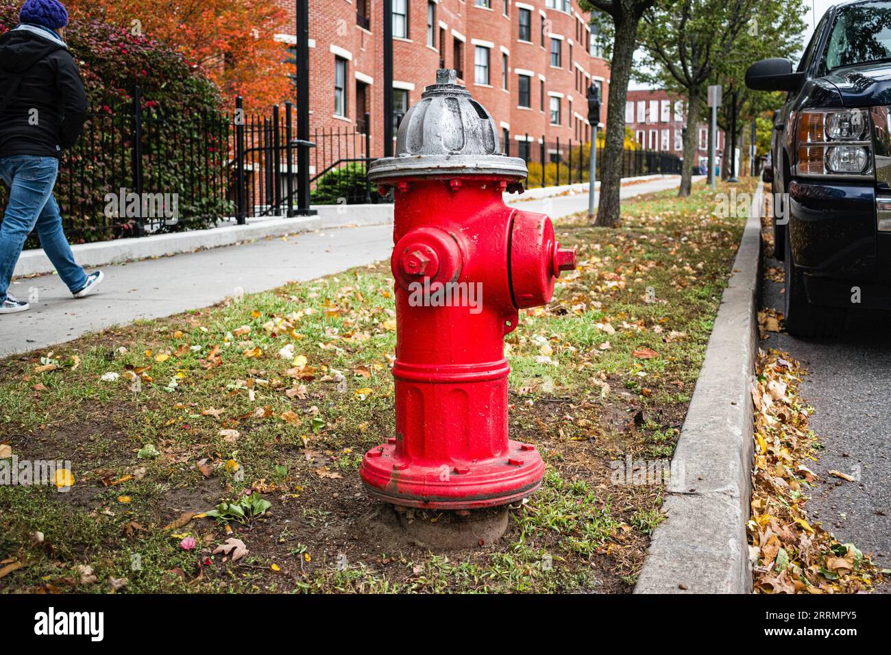 Silver-topped traditional red American style fire hydrant outside a ...