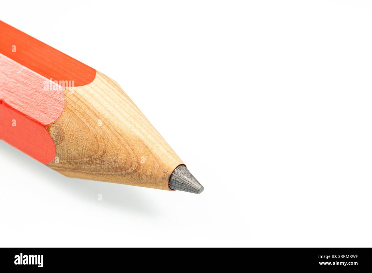 The tip of a sharpened red pencil close-up on a white background Stock ...