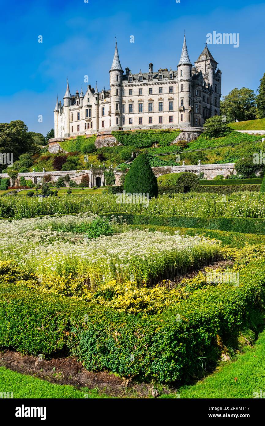 Medieval Dunrobin Castle on a hill and magnificent gardens at the foot ...