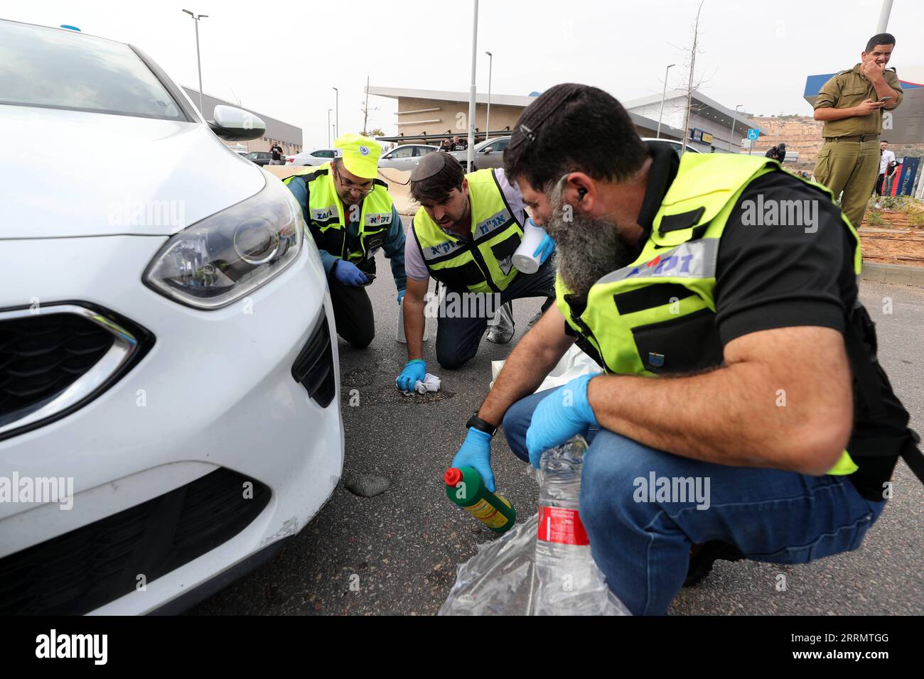 221115 -- ARIEL, Nov. 15, 2022 -- People work at the scene of an attack ...