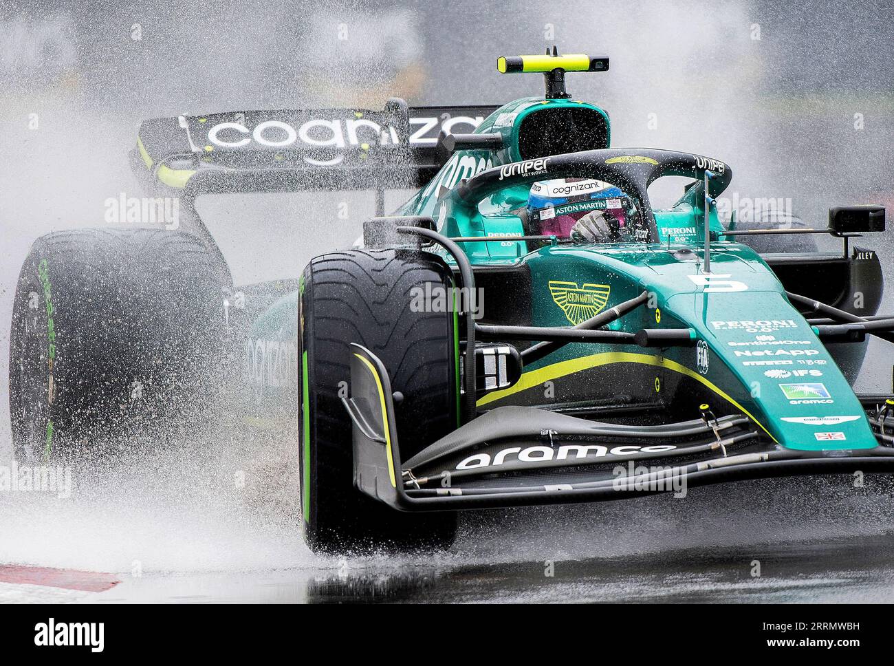 FILE - Aston Martin driver Sebastian Vettel, of Germany, takes a turn ...