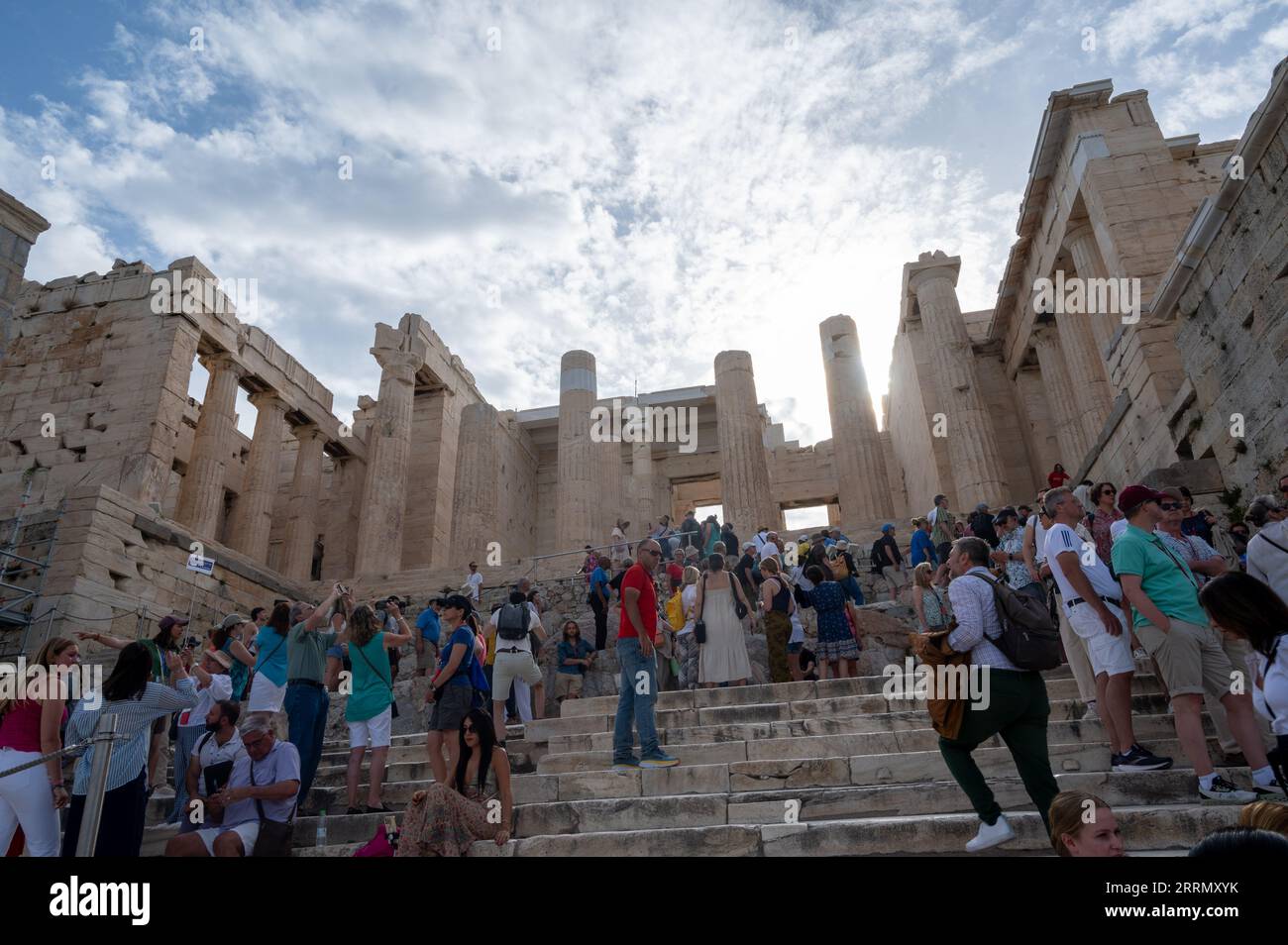 Tourists climb the steps to the entrance (Propylaia) of the Acropolis ...