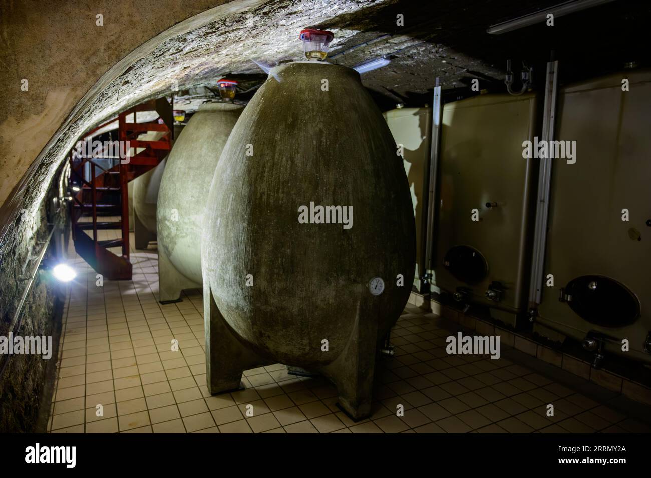 Concrete tanks eggs for fermentation process. Visit of undergrounds ...