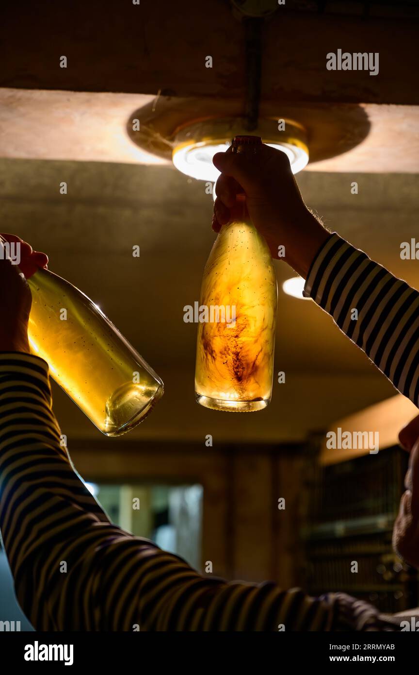 Visit of undergrounds caves, showing of sediment in bottle, traditional ...