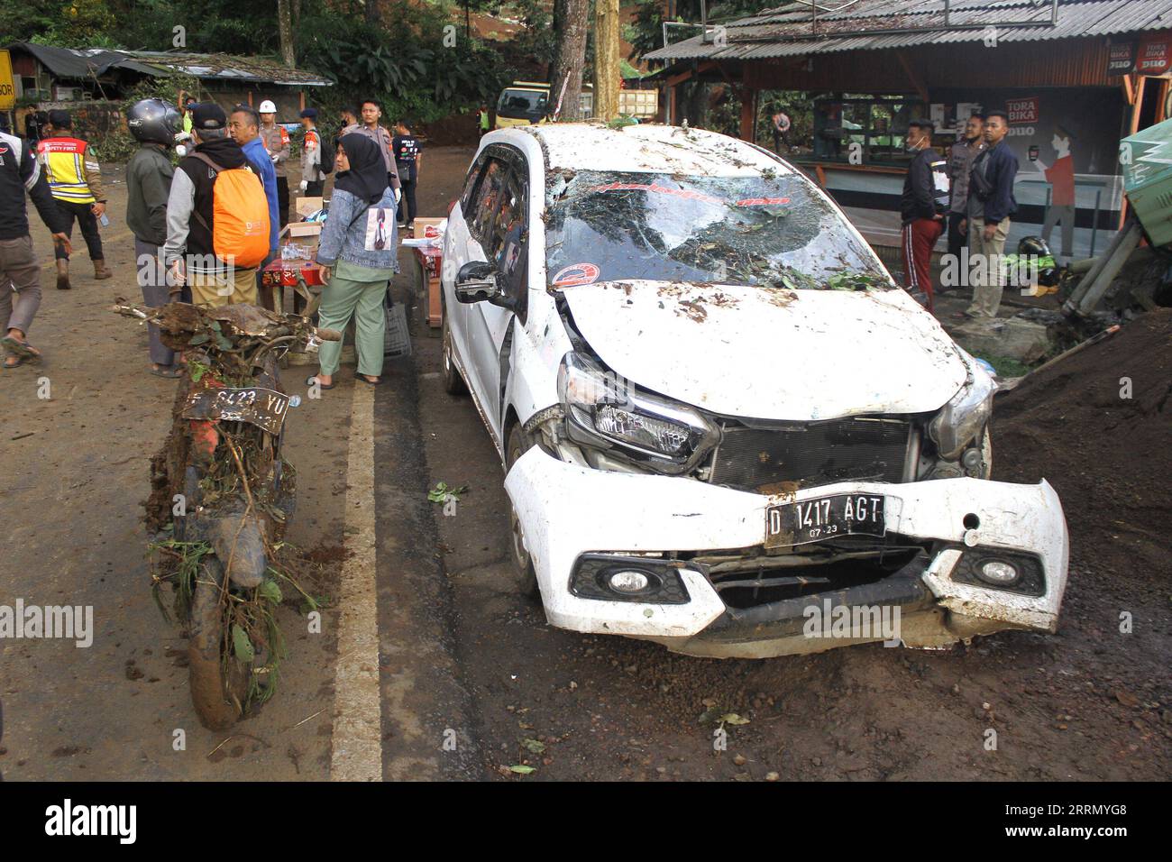 221121 -- WEST JAVA, Nov. 21, 2022 -- Damaged vehicles are seen after ...