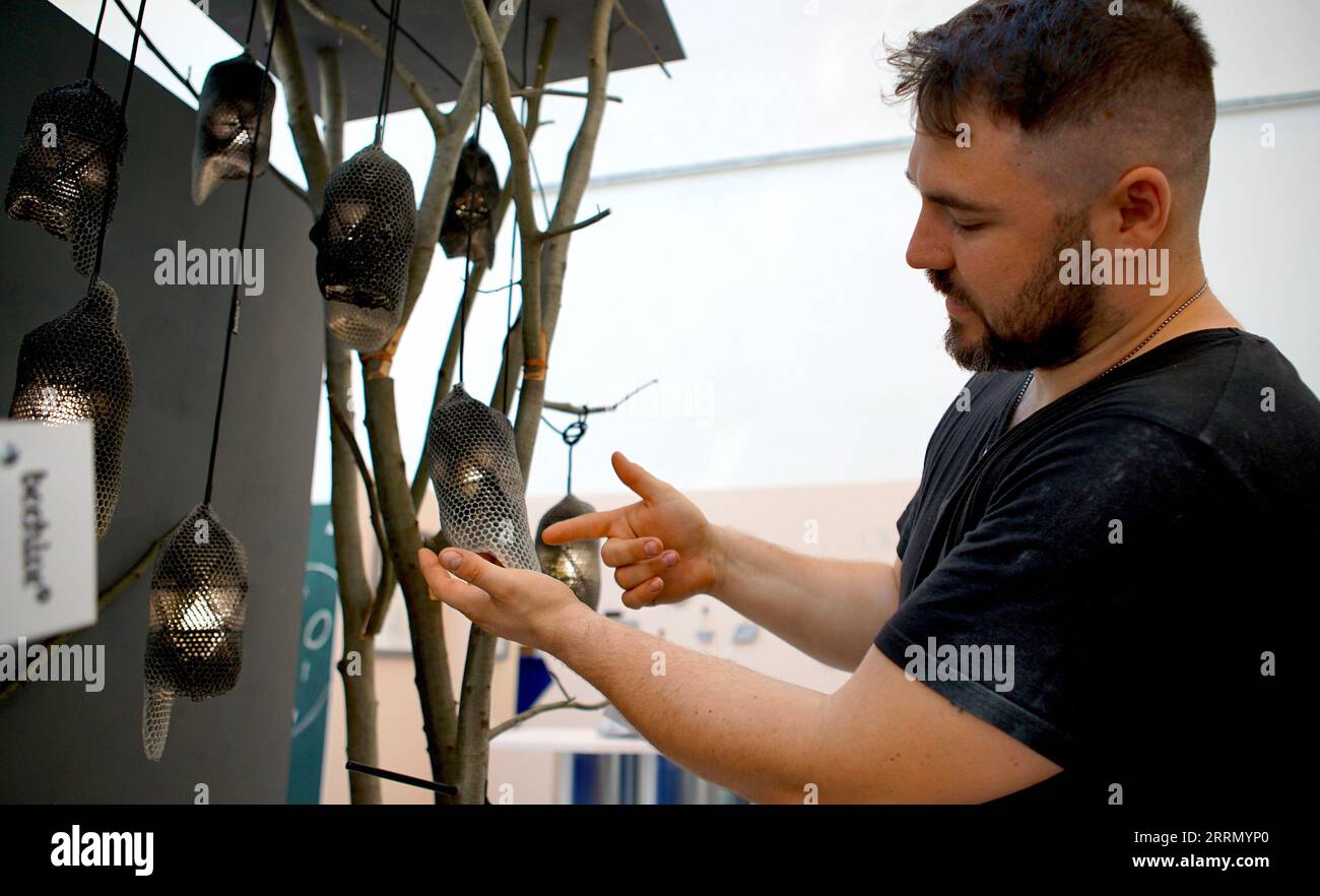 Prague, Czech Republic. 8th Sep, 2023. A designer shows his work during ...