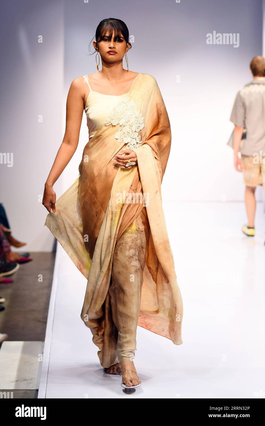 221203 -- COLOMBO, Dec. 3, 2022 -- A model presents a creation during ...