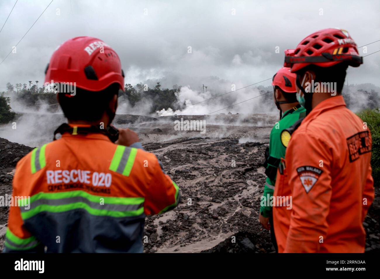 221204 -- LUMAJANG, Dec. 4, 2022 -- Rescuers inspect the affected area ...