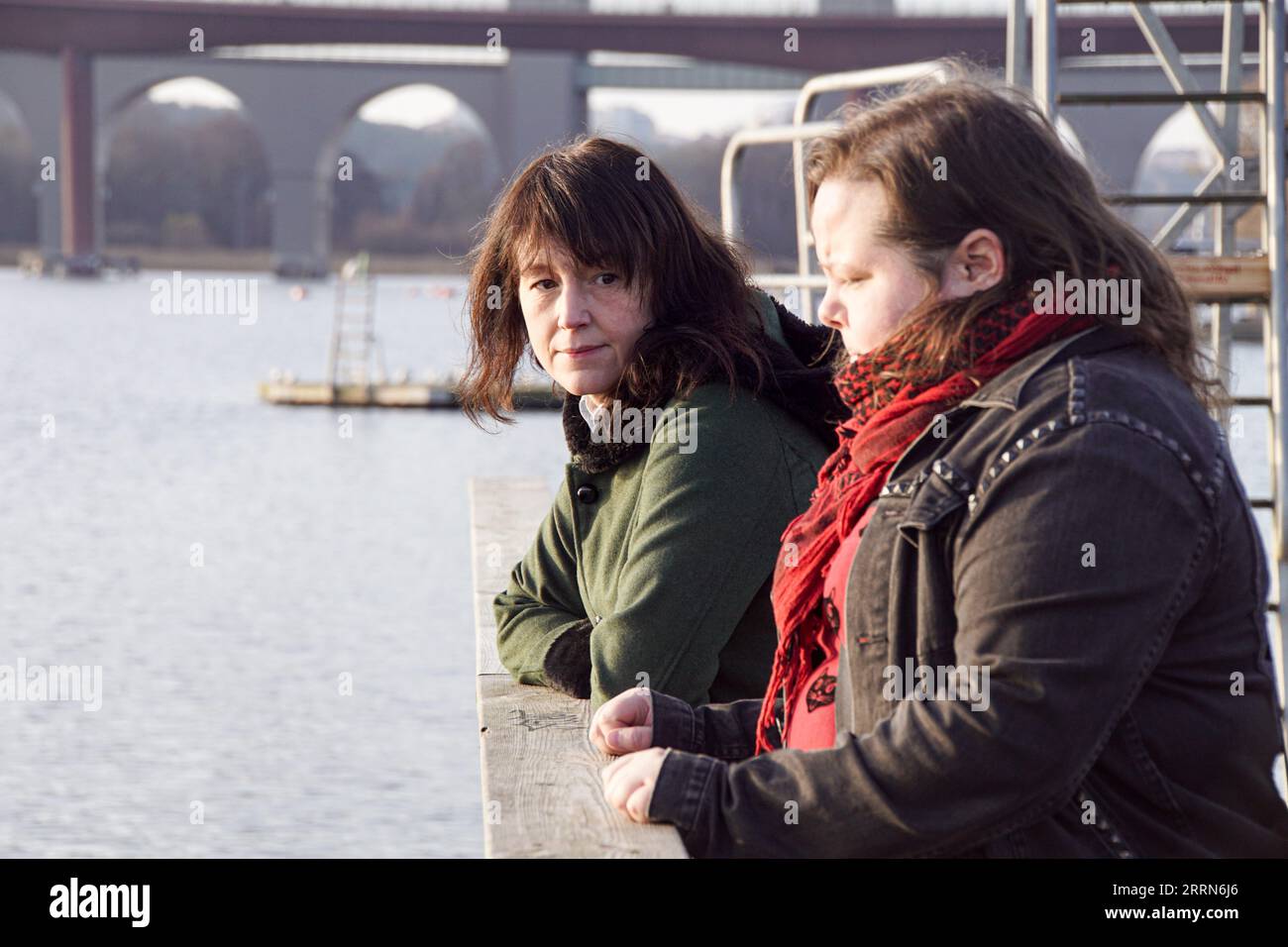 Women standing by bridge railing hi-res stock photography and images ...