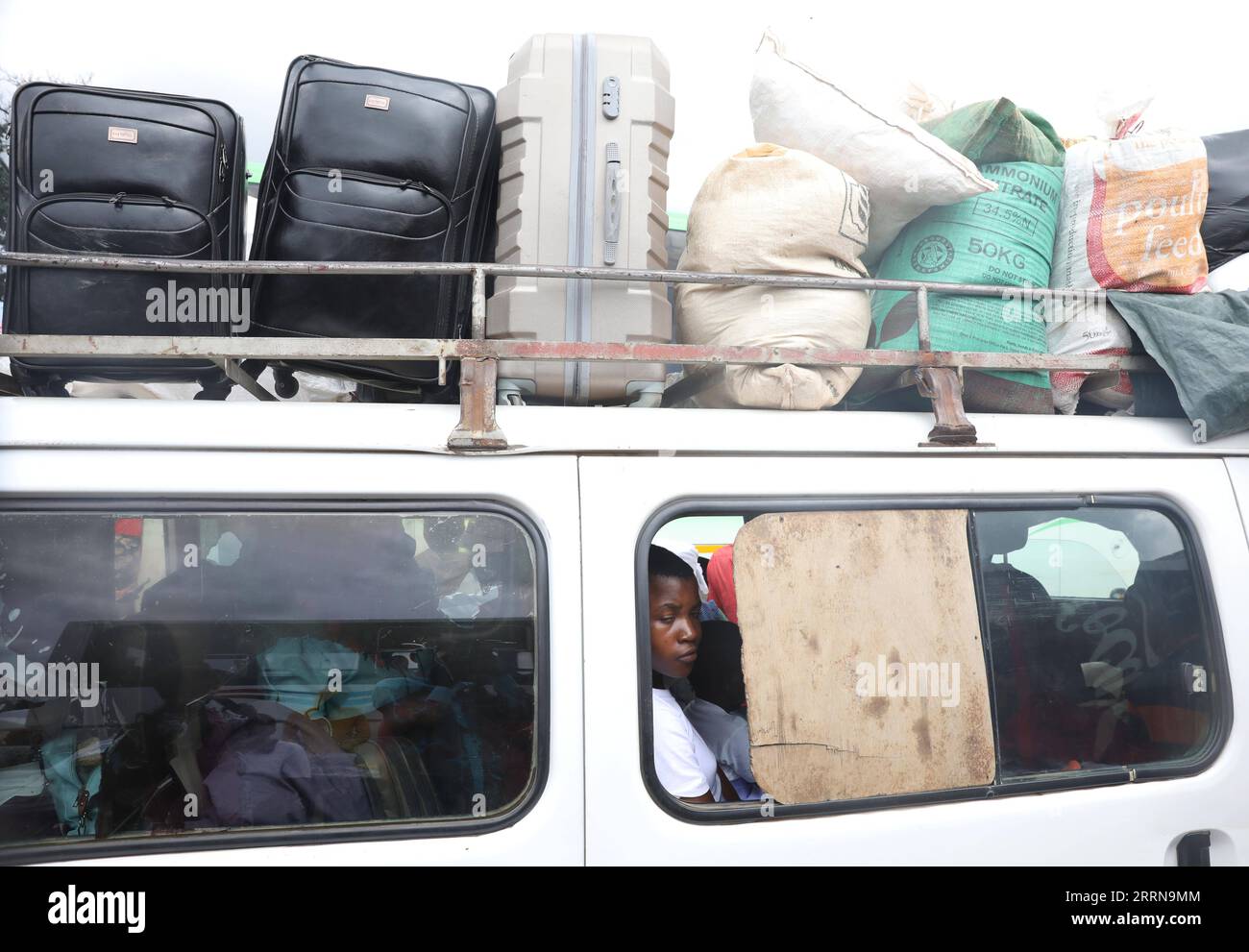 221226 -- HARARE, Dec. 26, 2022 -- A woman sits inside a loaded rural bus going for Christmas in ...