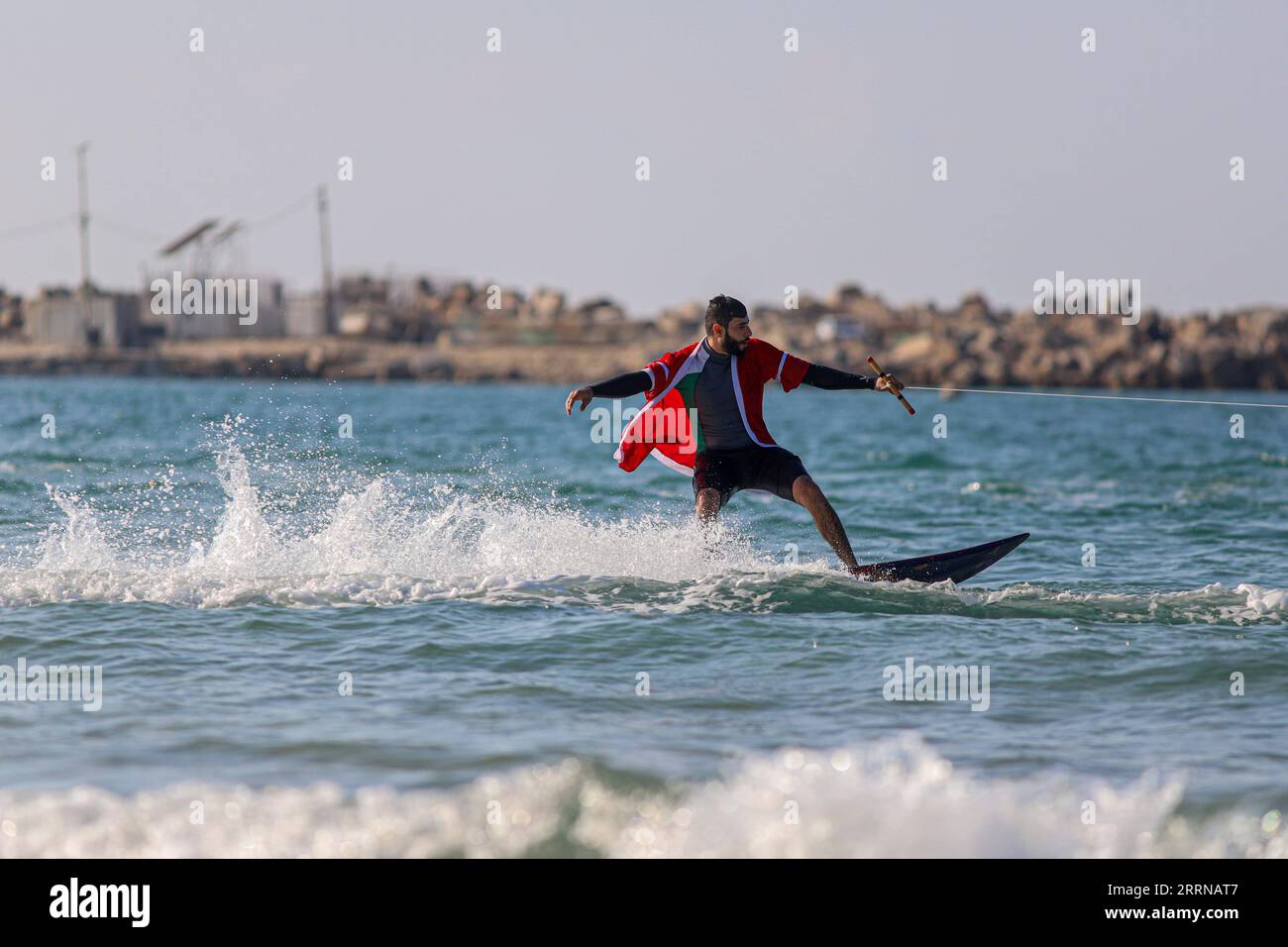 221230 -- GAZA CITY, Dec. 30, 2022 -- A Palestinian surfer dressed in ...